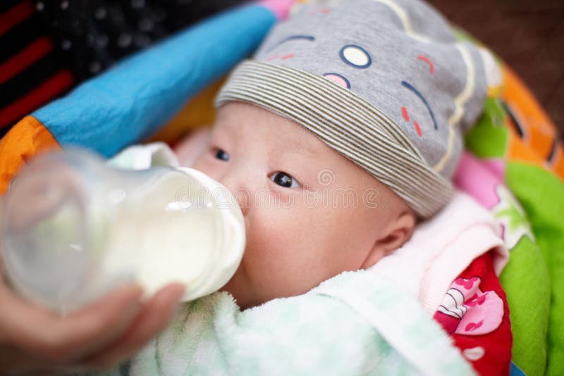 Baby being fed stock image. Image of love, month, drink - 38302135