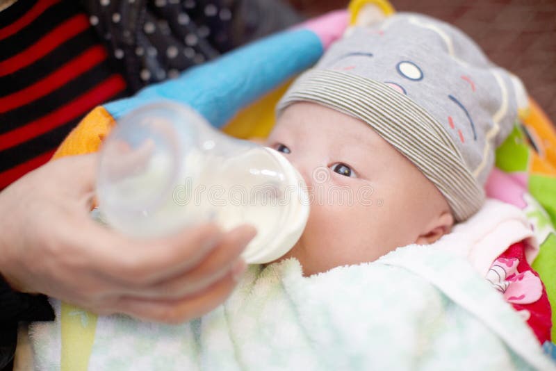 294 Baby Being Fed Happy Stock Photos - Free & Royalty-Free Stock ...