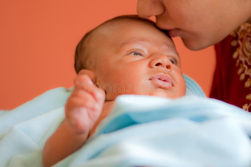 Mother cuddling baby stock photo. Image of male, family - 5105916