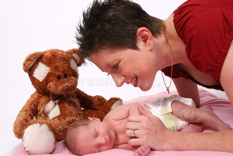 Baby Being Watch by Loving Mother Stock Photo - Image of check, care ...