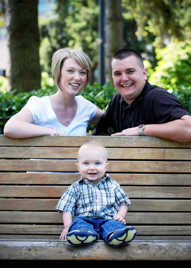 Baby on bench - vertical stock image. Image of midlife - 5560117