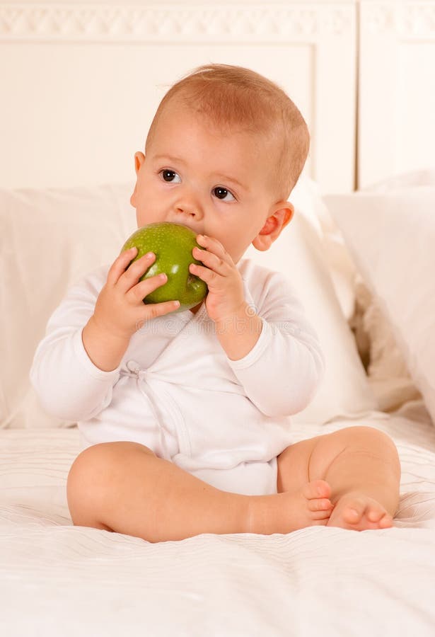 Baby biting an apple stock image. Image of child, beautiful - 21351471