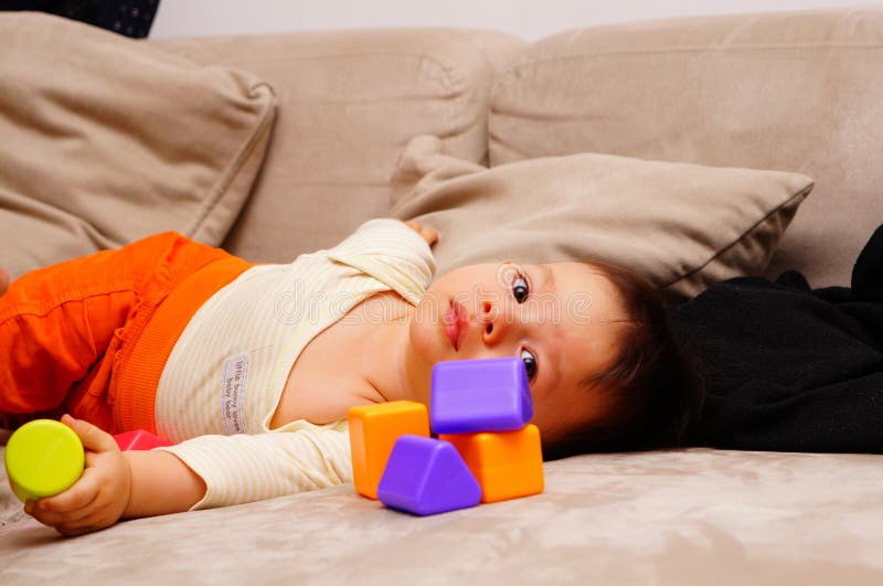 Baby and blocks stock image. Image of sofa, baby, plastic - 48786795
