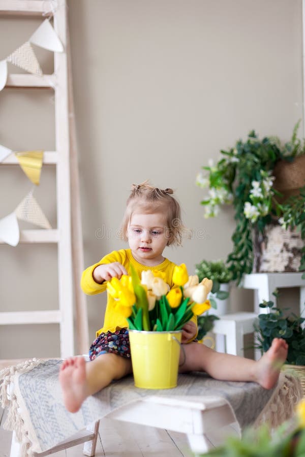 Baby with Bouquet of Yellow Tulips Stock Image - Image of tulips ...