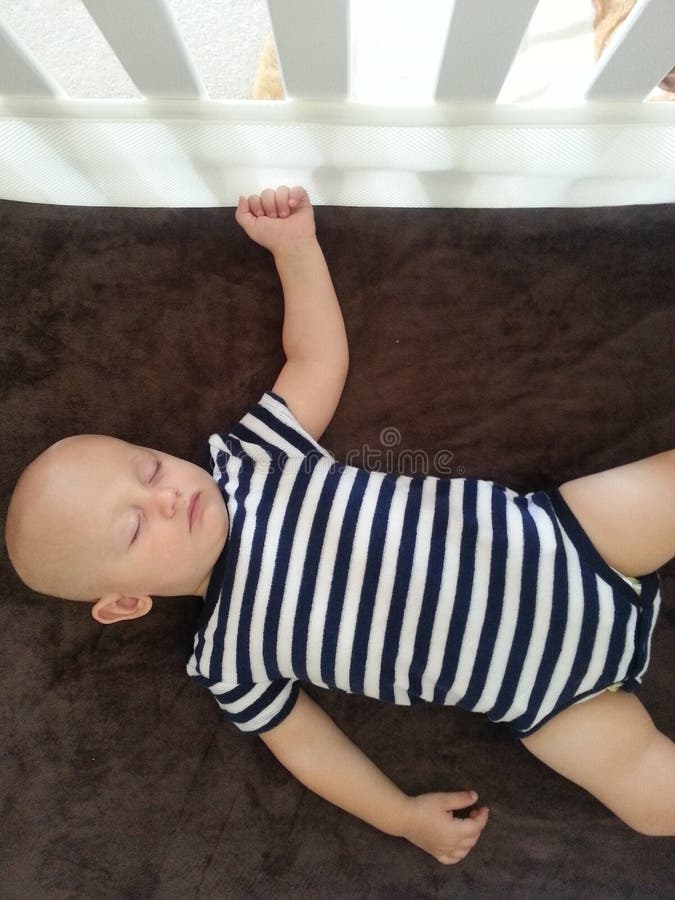 Baby Boy Asleep in Crib stock image. Image of napping - 43115935