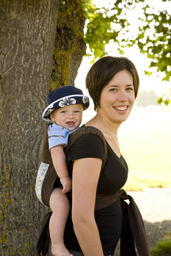 Baby Boy in Backpack stock photo. Image of outdoors, face - 9588212