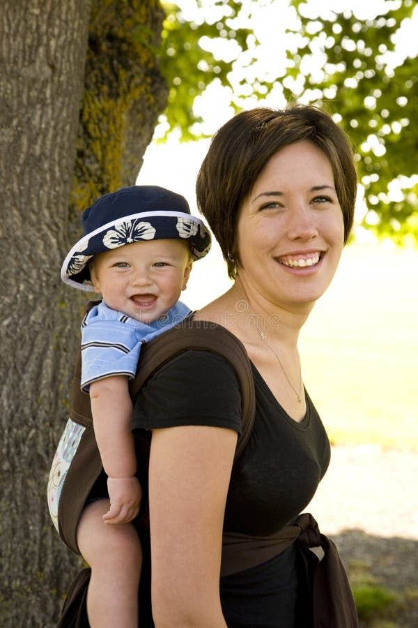 Baby with Mom in Baby Carrier Stock Photo - Image of hold, holding ...