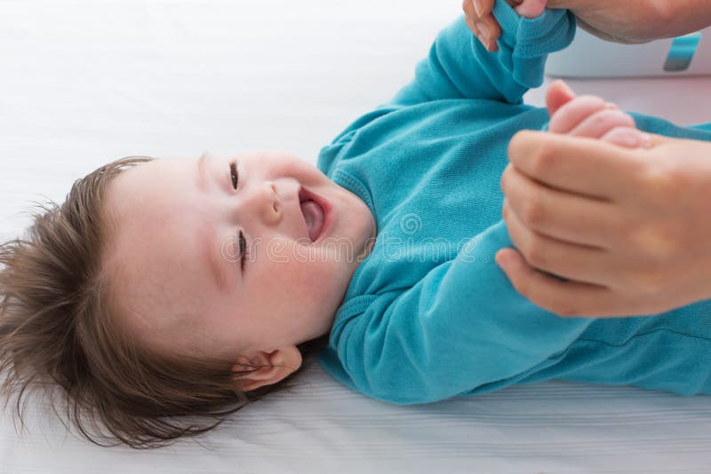 Baby Boy Being Cared for by His Mother Stock Photo - Image of playing ...