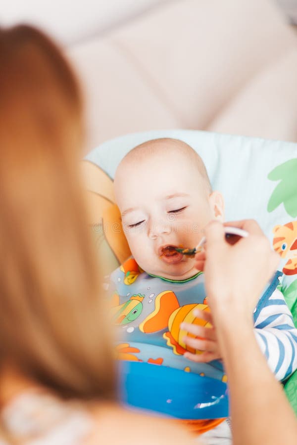 Baby boy being fed stock image. Image of mother, hungry - 69135175