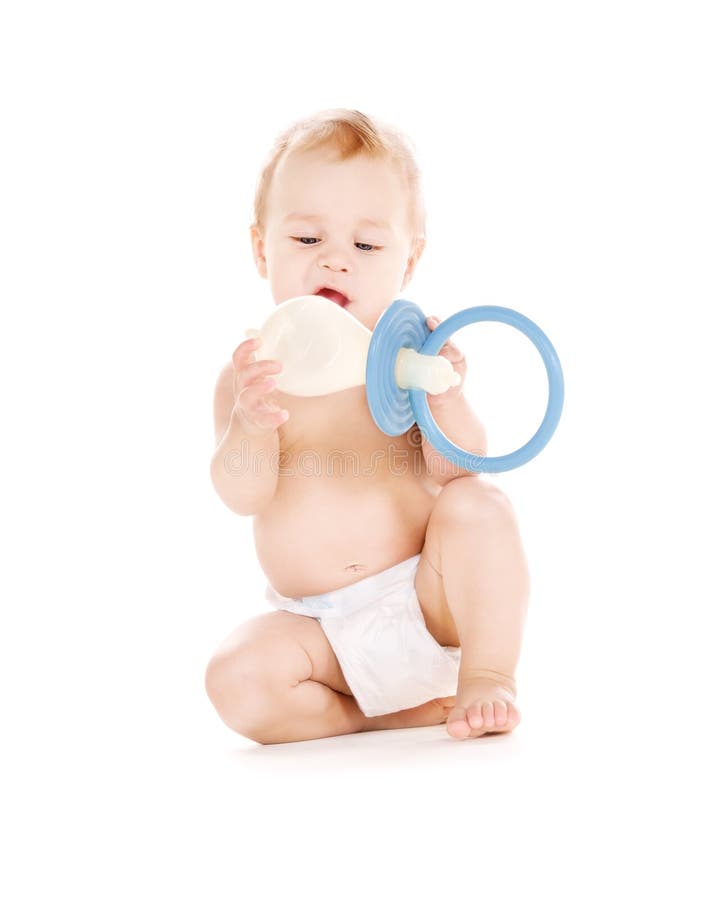 Baby boy with big pacifier stock image. Image of childcare - 12825267