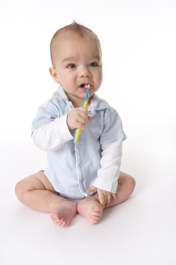 Baby boy brushing teeth stock photo. Image of sitting - 15323976