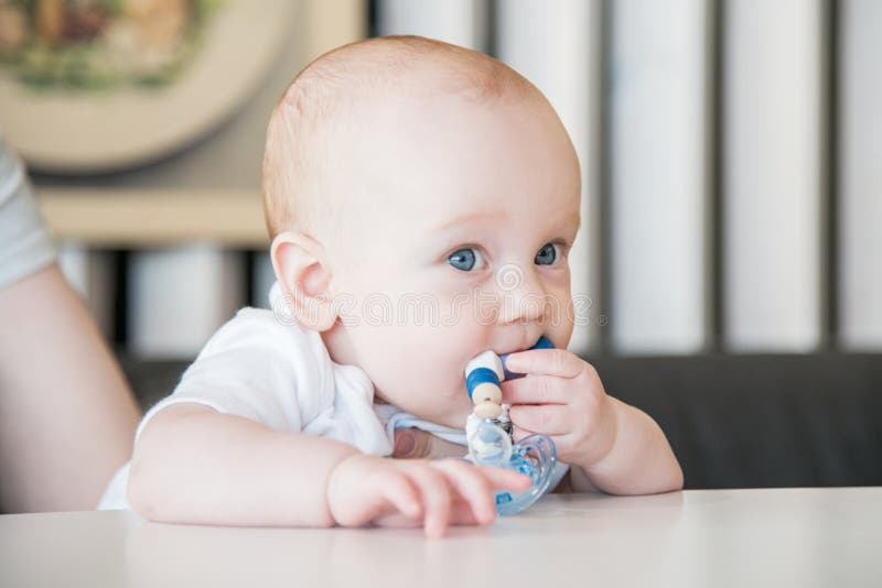 Baby boy chewing toy stock photo. Image of months, infant - 105099004