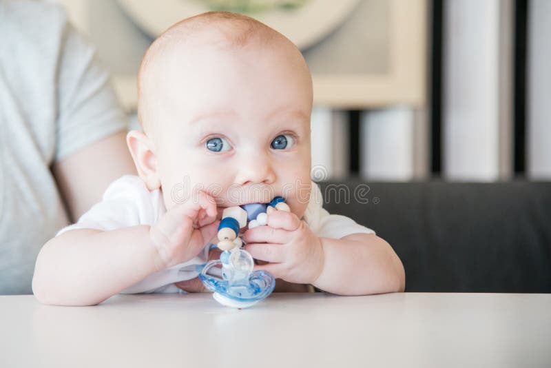 Baby boy chewing toy stock image. Image of love, sweet - 105099077