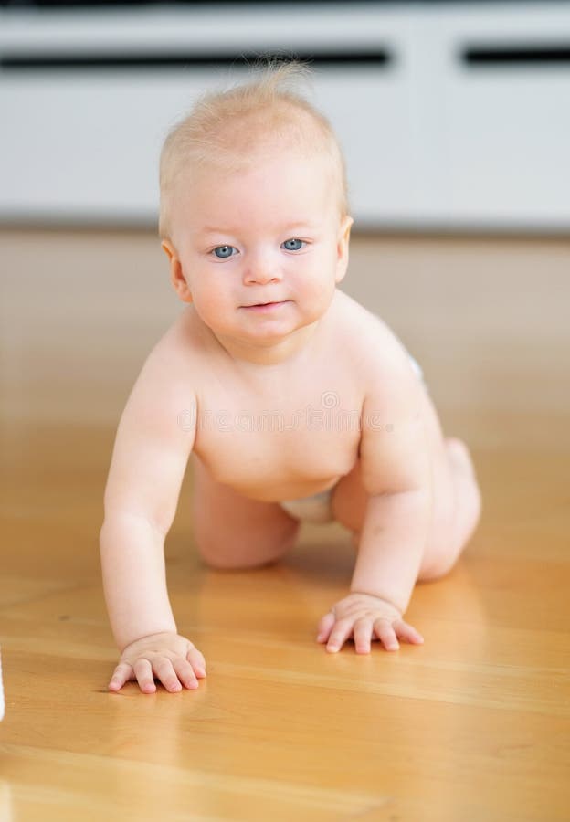Baby boy crawling stock photo. Image of care, indoor - 76084044