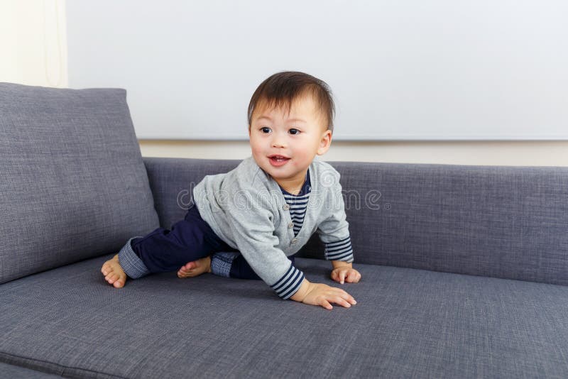 Baby boy creep on sofa stock photo. Image of japanese - 41304404