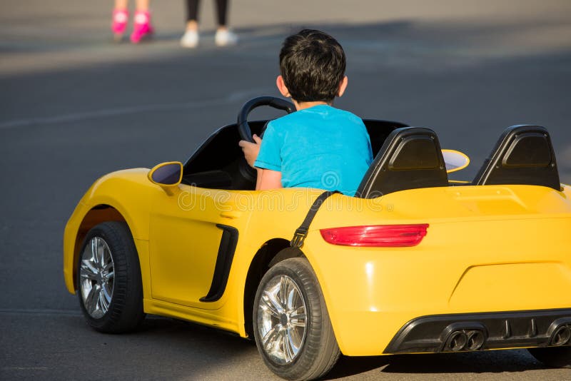 Baby boy driving car toy stock photo. Image of people - 242710184