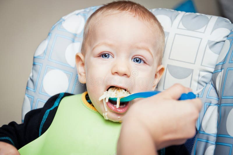 Baby boy eating stock photo. Image of lunch, meal, mealtime - 22923206