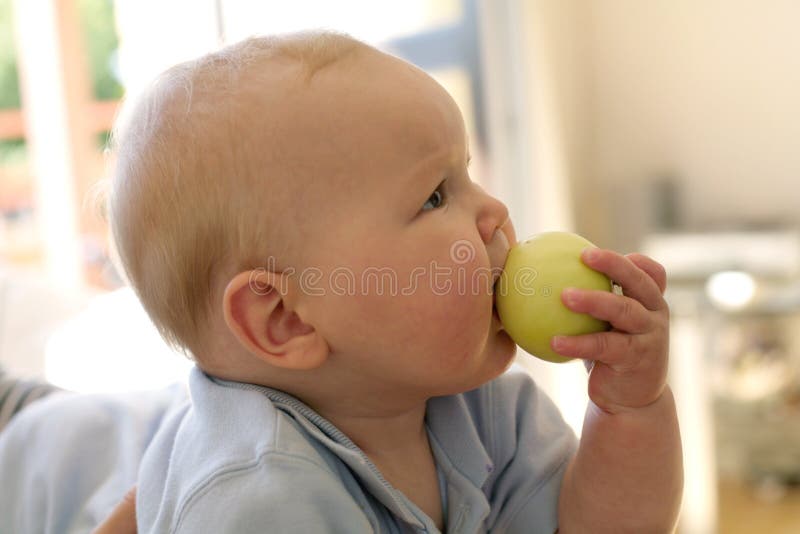 Baby boy eating apple stock photo. Image of food, light - 4757998