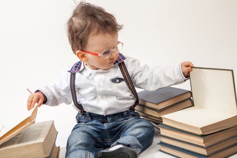 Baby Boy with Eyeglasses Looking at a Book Stock Image - Image of books ...