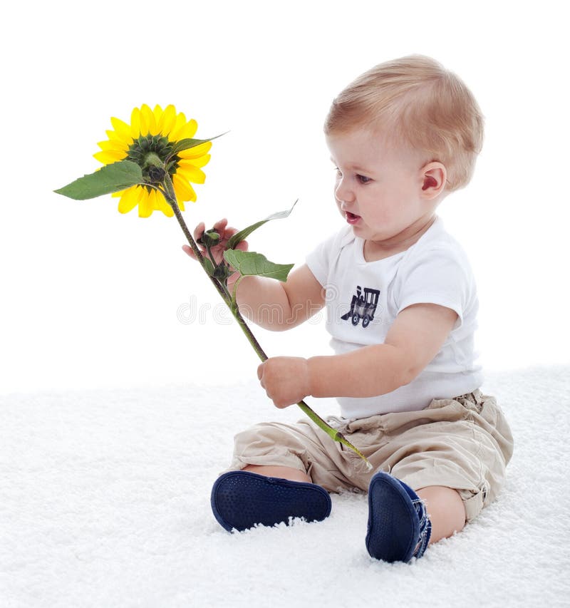 Baby boy with flower stock photo. Image of closeup, beautiful - 44609482