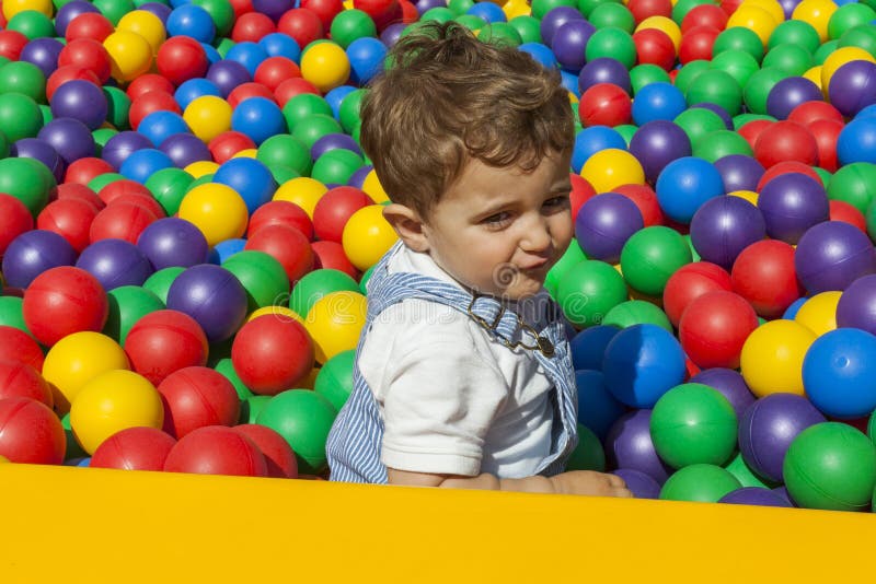 Baby Boy Having Fun Playing in a Colorful Plastic Ball Pool Stock Photo ...