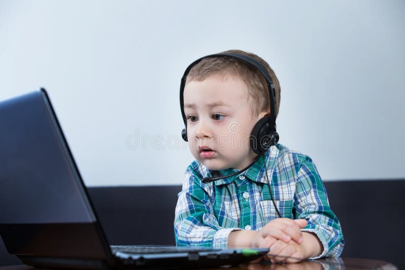 Baby Boy with Headphones Using the Computer Stock Photo - Image of ...