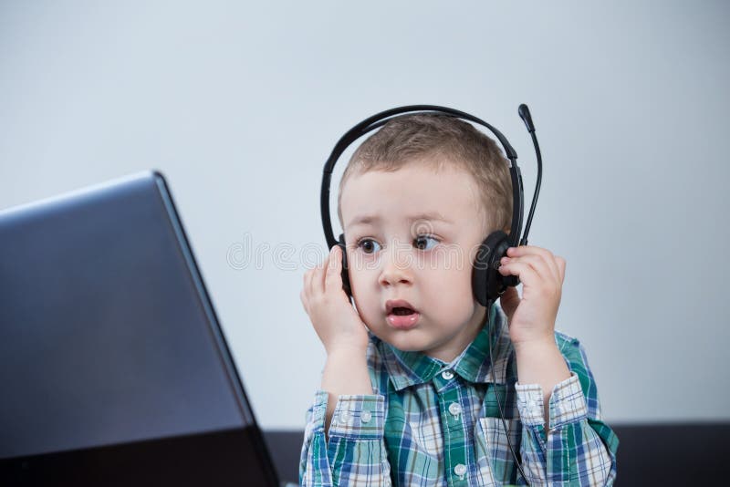 Baby boy with headphones stock image. Image of listening - 40210923