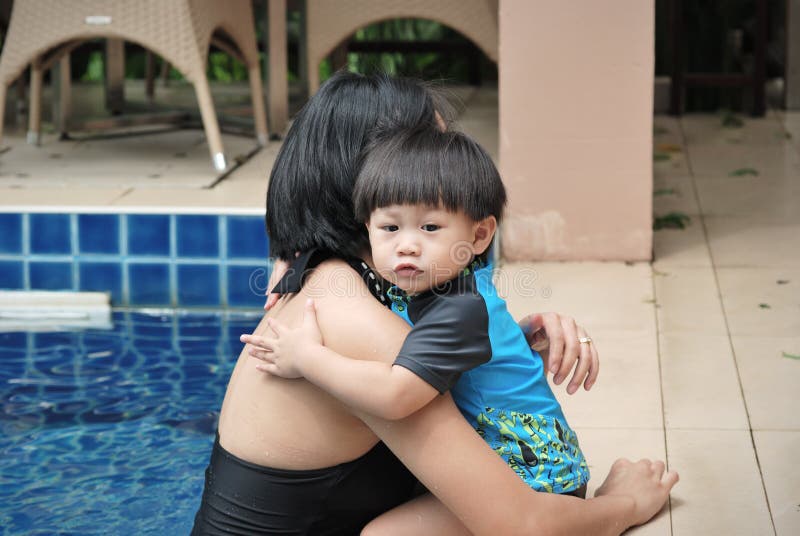 Baby Boy Hugging Mother in Pool Stock Photo - Image of mother ...