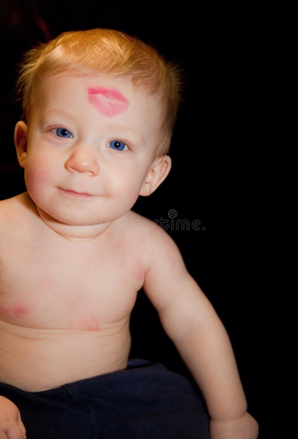 Baby boy with kiss mark stock image. Image of stare, cute - 47297713