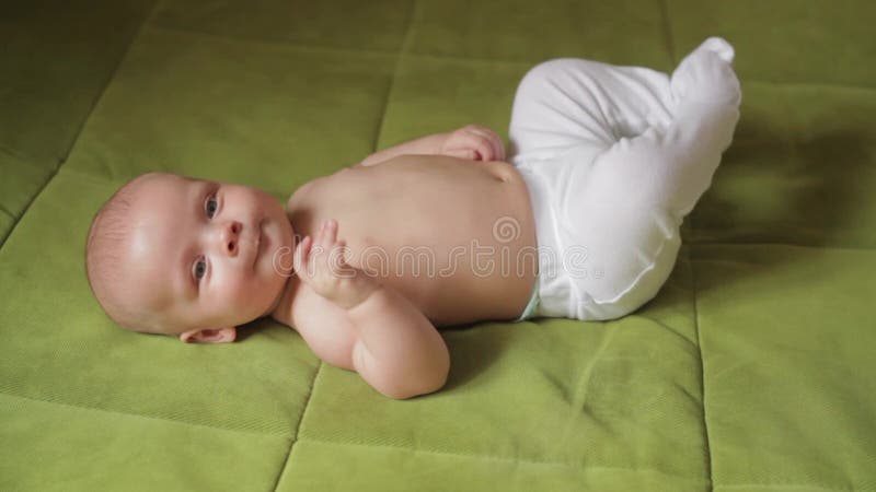 Baby Boy is Laid on His Back Smiling into the Camera. Stock Video ...