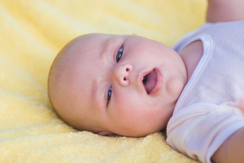 Baby boy laying down stock photo. Image of small, person - 26123096