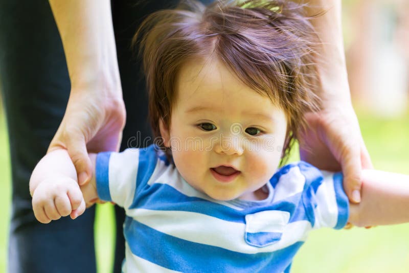Baby Boy Learning To Walk Outside Stock Photo - Image of baby, little ...