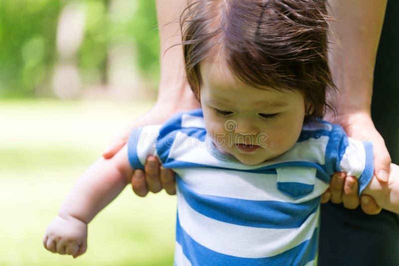 Baby Boy Learning To Walk Outside Stock Photo - Image of father ...