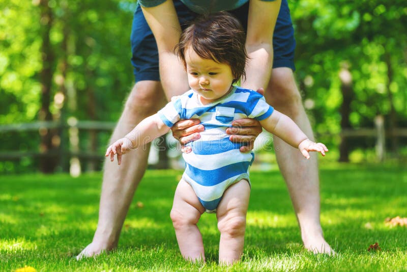 Baby Boy Learning To Walk Outside Stock Photo - Image of grass, baby ...