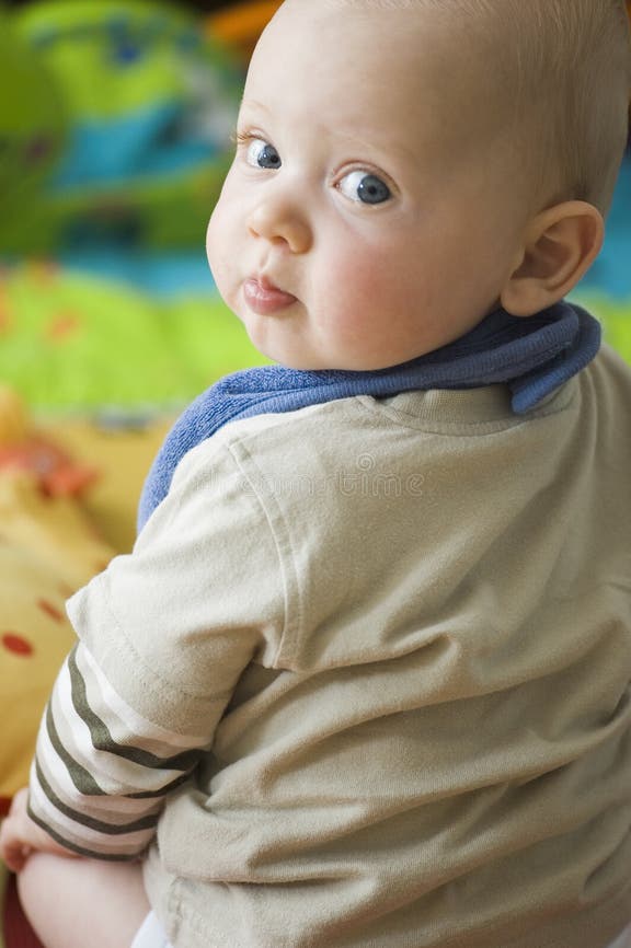 Baby boy looking backwards stock image. Image of inquisitive - 12855741