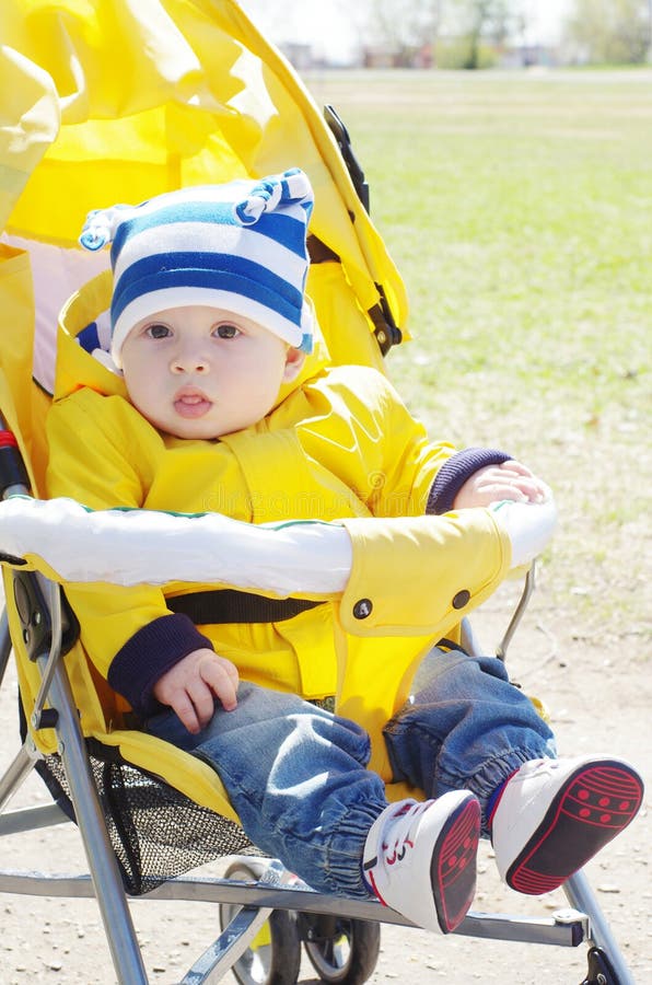 Baby Boy Outdoors on Yellow Buggy in Spring Stock Image - Image of ...