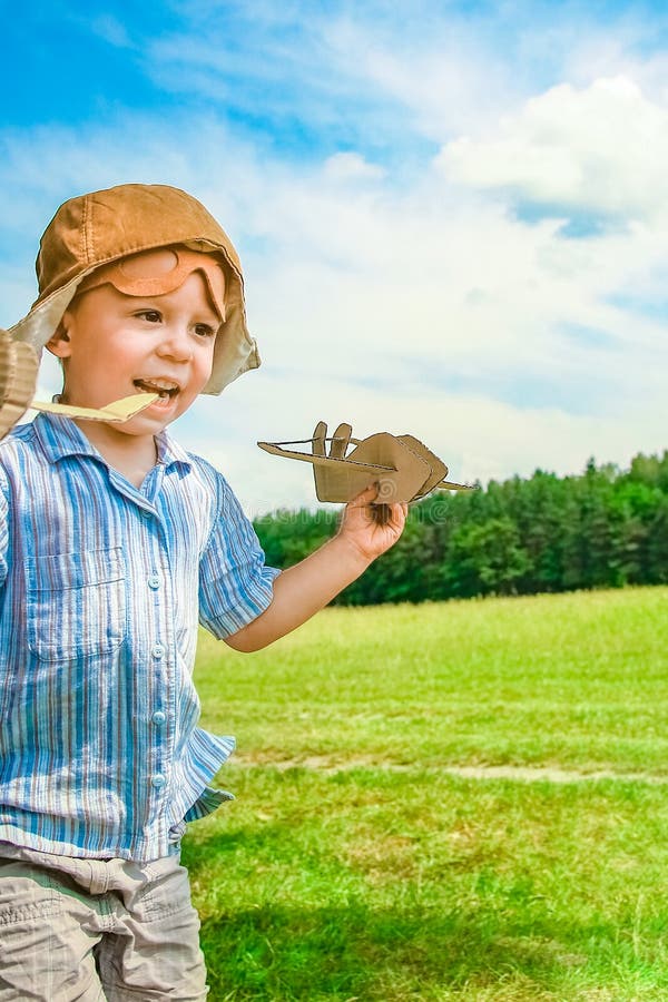 A Baby Boy by the Plane Plays on Nature in the Park. Boy on Vacation ...