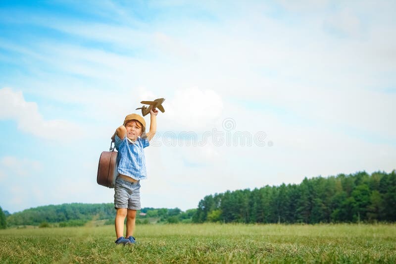 A Baby Boy by the Plane Plays on Nature in the Park. Boy on Vacation ...