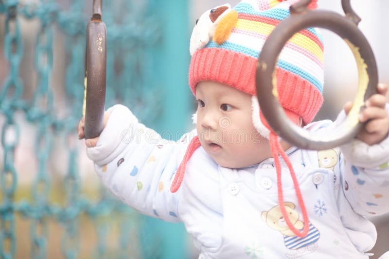 Baby Boy Play the Swinging Rings Stock Image - Image of happiness, love ...