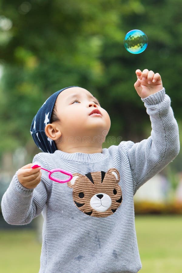 Baby boy playing bubble stock image. Image of male, lovely - 87736245