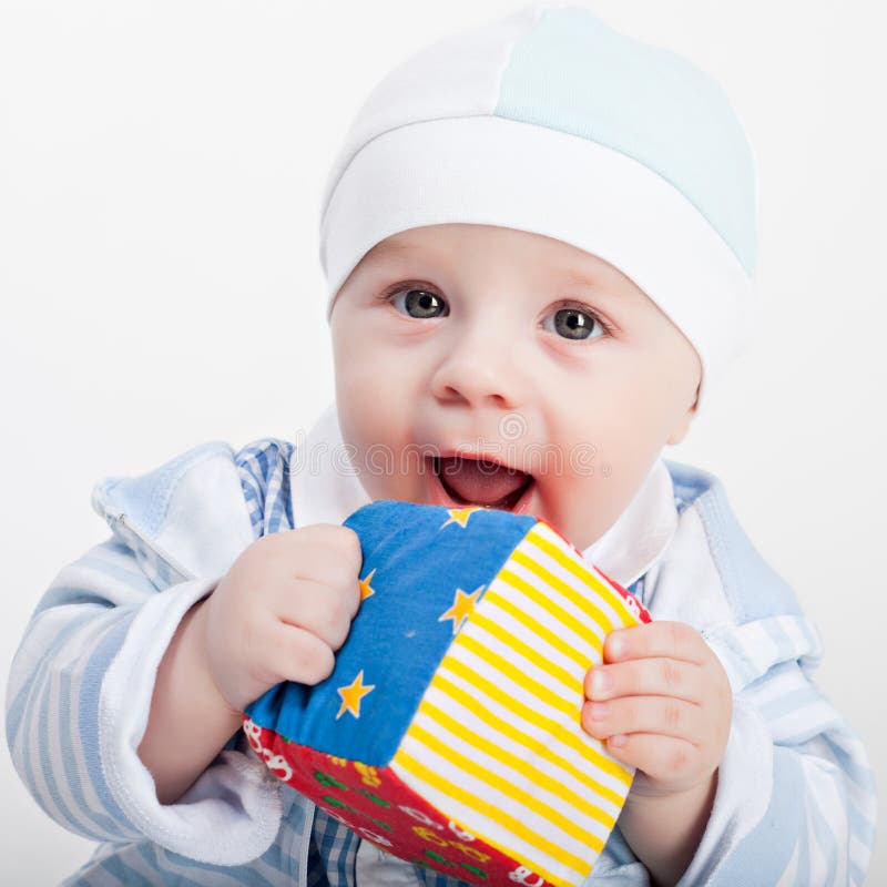 Baby Boy Playing with a Cube Stock Photo - Image of playful, diaper ...