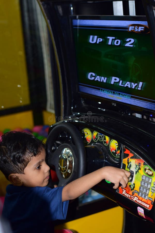 A Baby Boy Playing Electronically Controlled Game& X27;s in Play ...