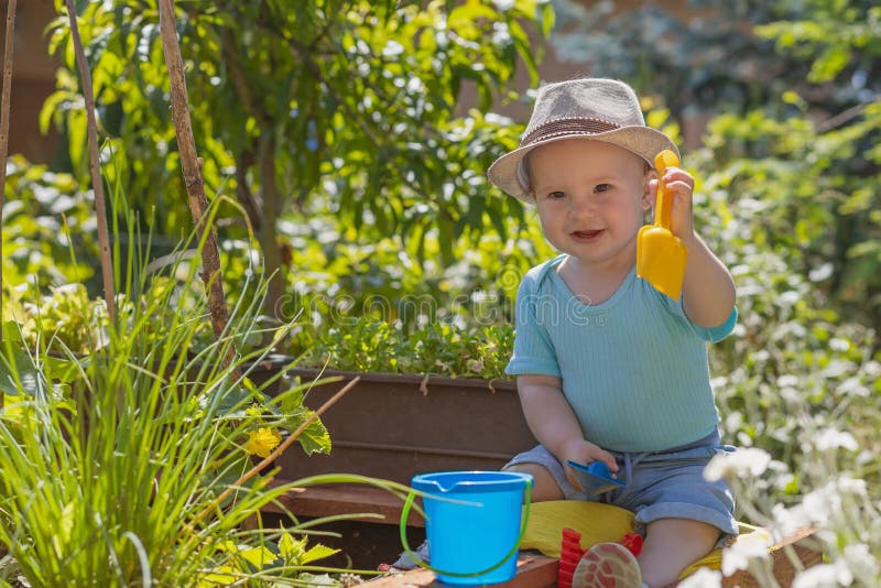 Baby Boy Playing with Kids Gardening Tools Stock Photo - Image of ...