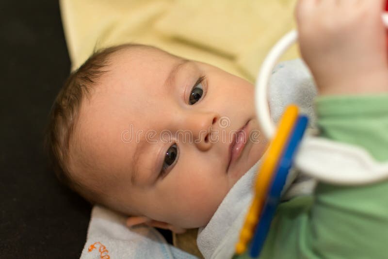 Baby boy playing with toy stock image. Image of childhood - 91137895