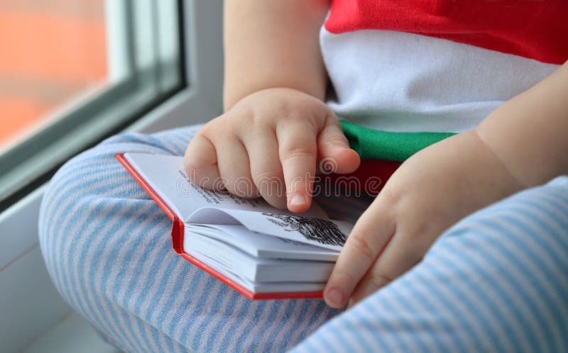Baby Boy Reading a Book, Dclose Up of Hands Leafing through the Pages ...