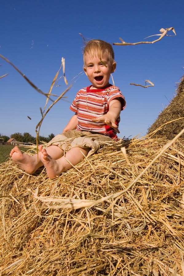 Boy on hay ride stock photo. Image of country, minor, overalls - 1659008