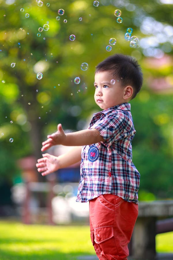 Children Playing with Soap Bubbles Stock Photo - Image of floating ...
