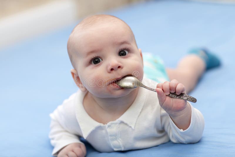 Baby boy with spoon stock image. Image of head, baby - 23444003