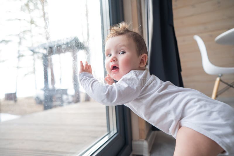 Cute Little Boy Lying on His Forearms on the Floor. Stock Photo - Image ...