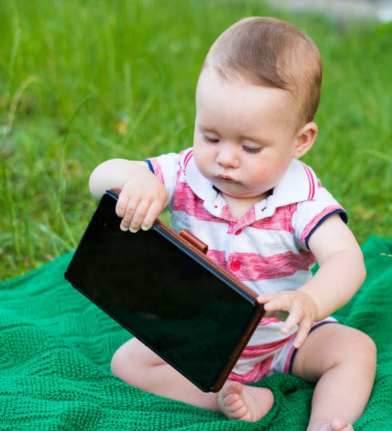 Baby boy with tablet stock image. Image of education - 73593077